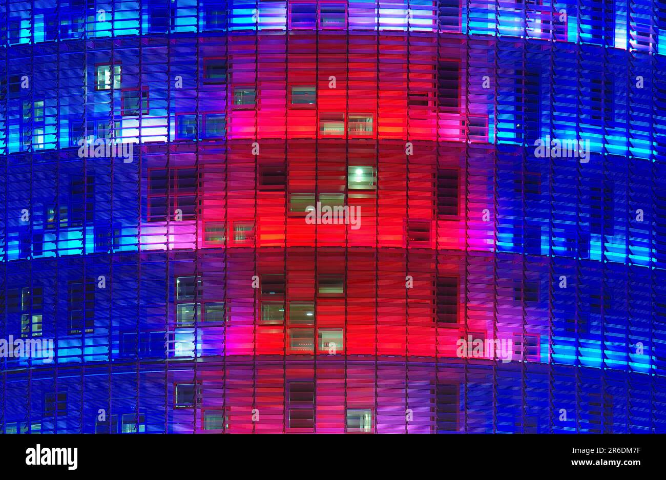modern office building at night illuminated in colors Stock Photo - Alamy