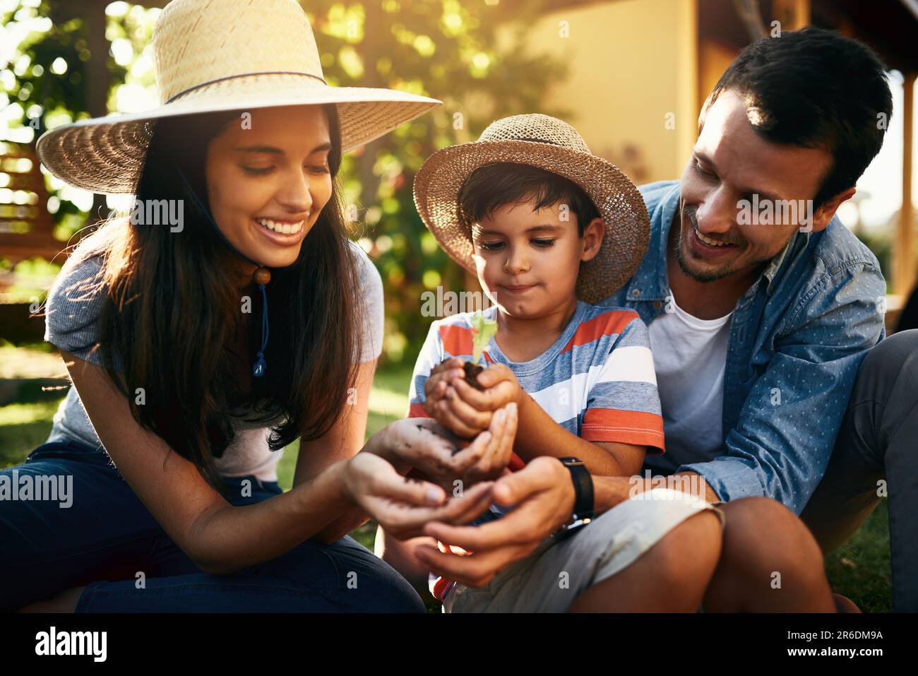 Happy family, plants or parents with child in garden for sustainability ...