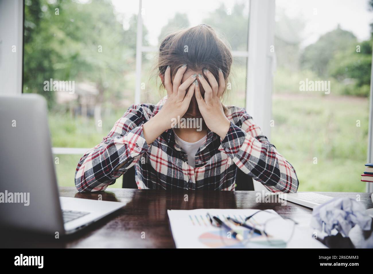 woman sitting down, his face unsettled. At the computer desk she has ...
