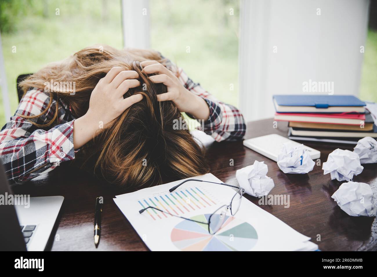 Woman with head down on desk hi-res stock photography and images - Alamy