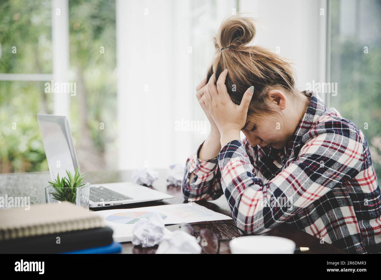 woman sitting down, his face unsettled. At the computer desk she has ...