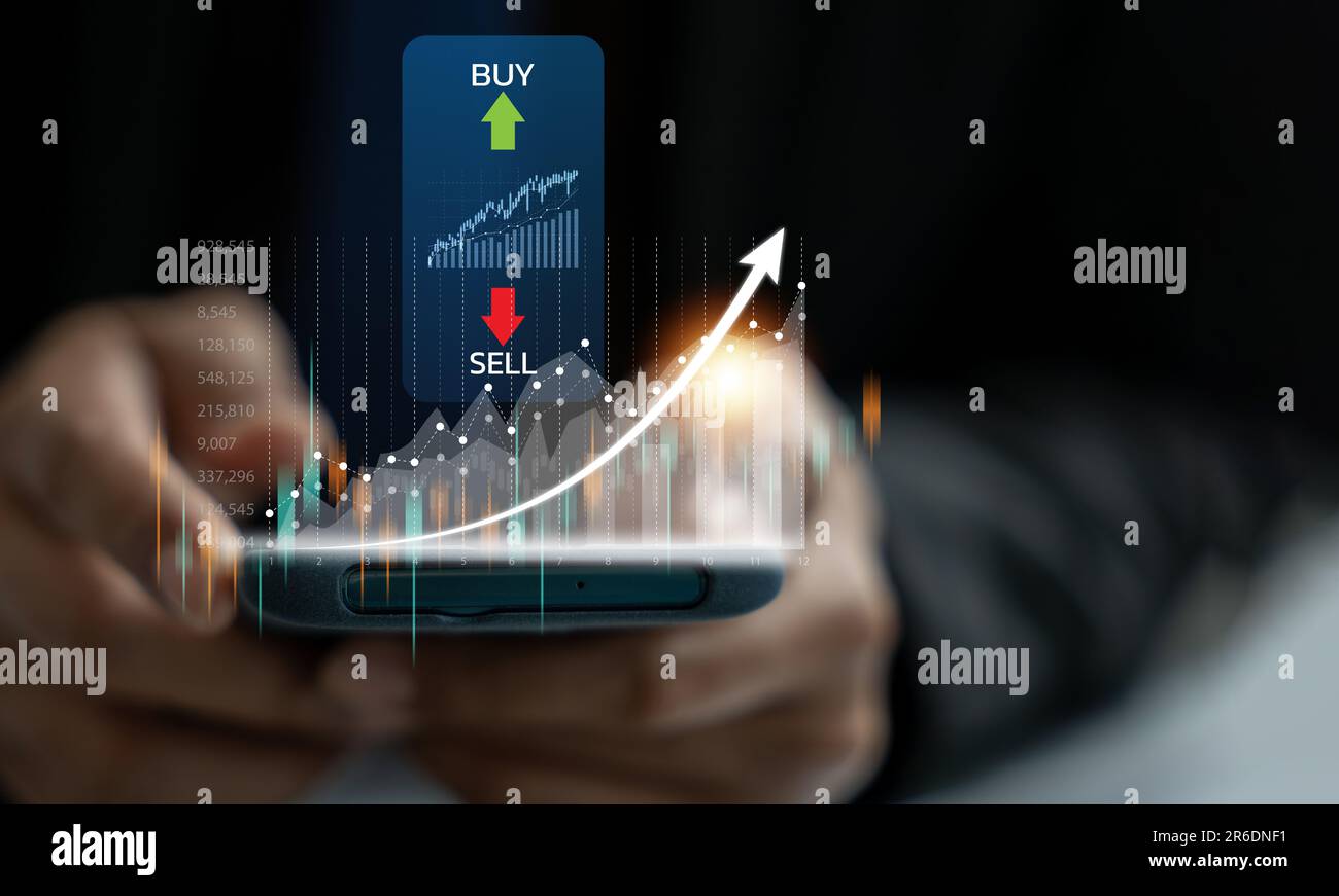 Man monitoring stock market trends and trading activities Stock Photo ...