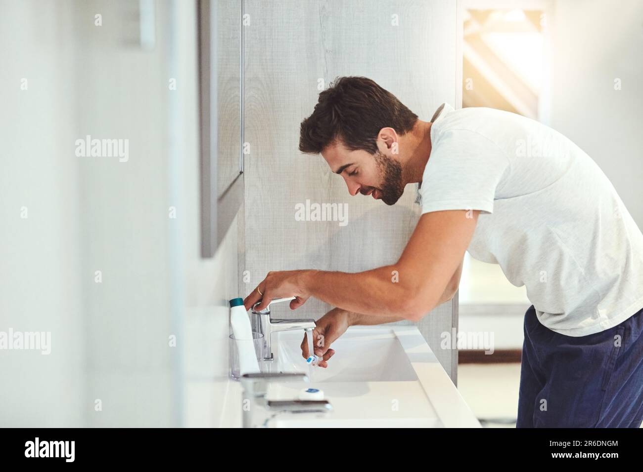 Dental, morning and brushing teeth with man in bathroom for cleaning ...