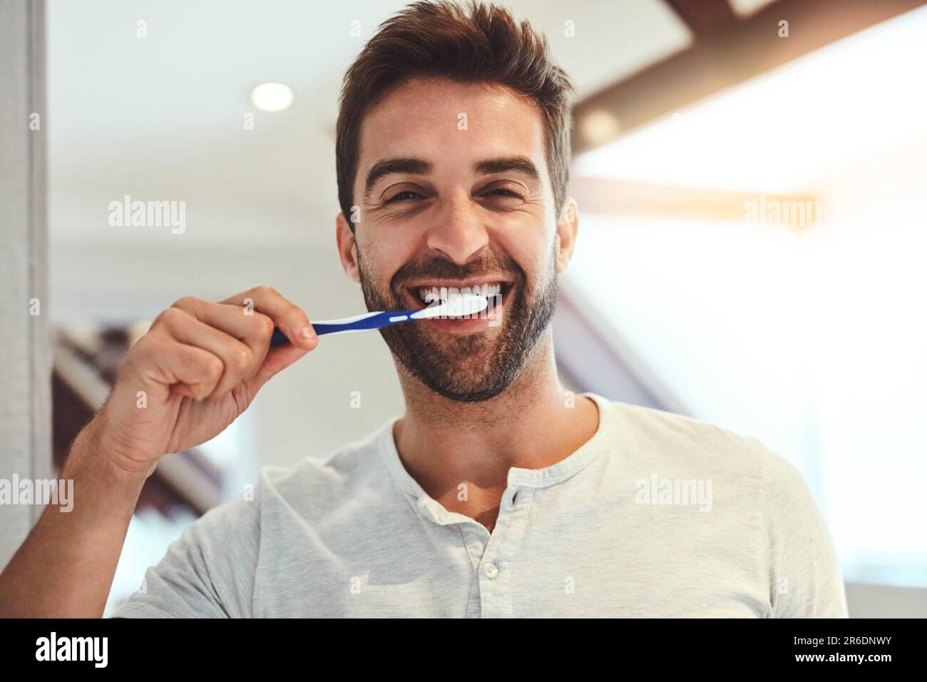 Dental, portrait and brushing teeth with man in bathroom for cleaning ...