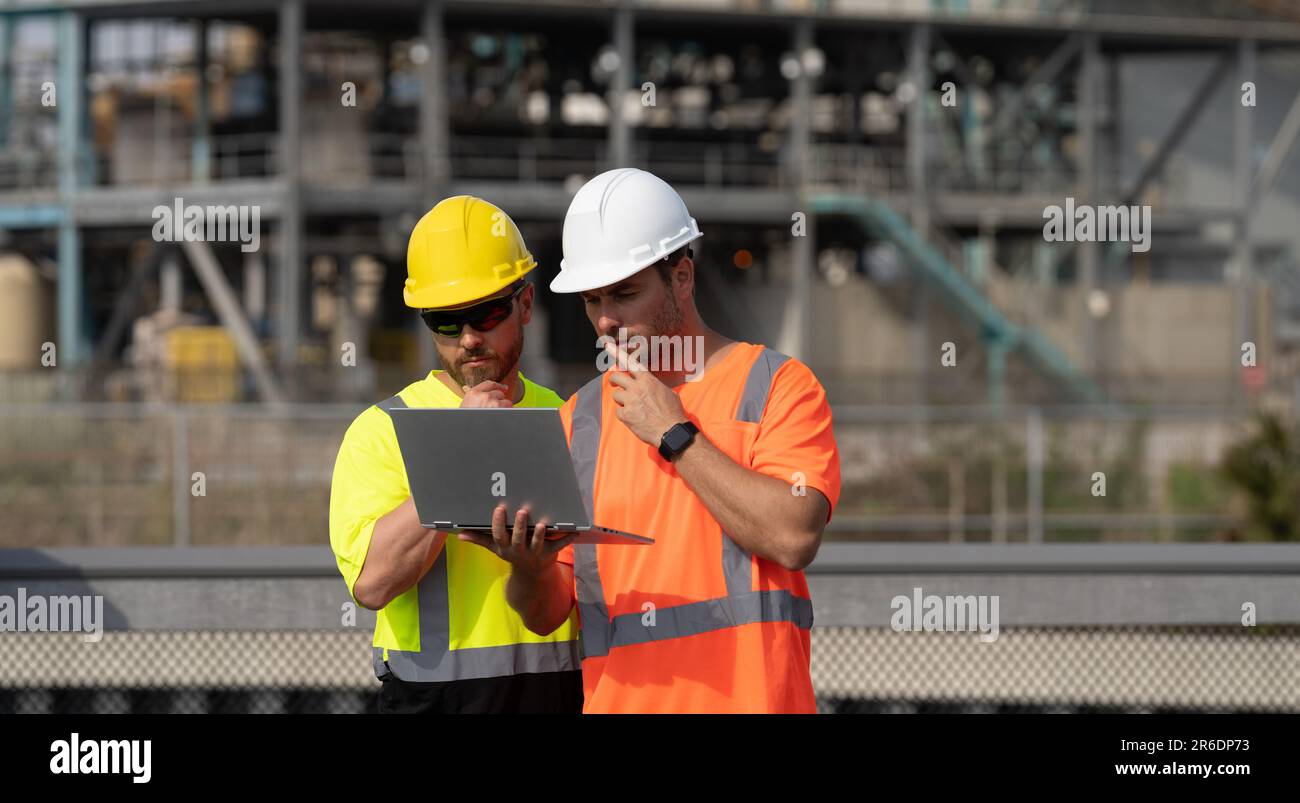 pondering supervisor men with construction project. supervisor men with ...