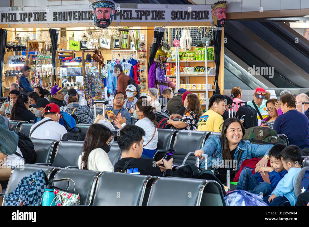 Passengers waiting at departure gate at Ninoy Aquino International ...