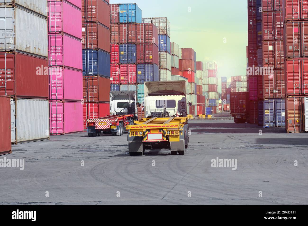 Trucks in the view of the container industry Stock Photo - Alamy