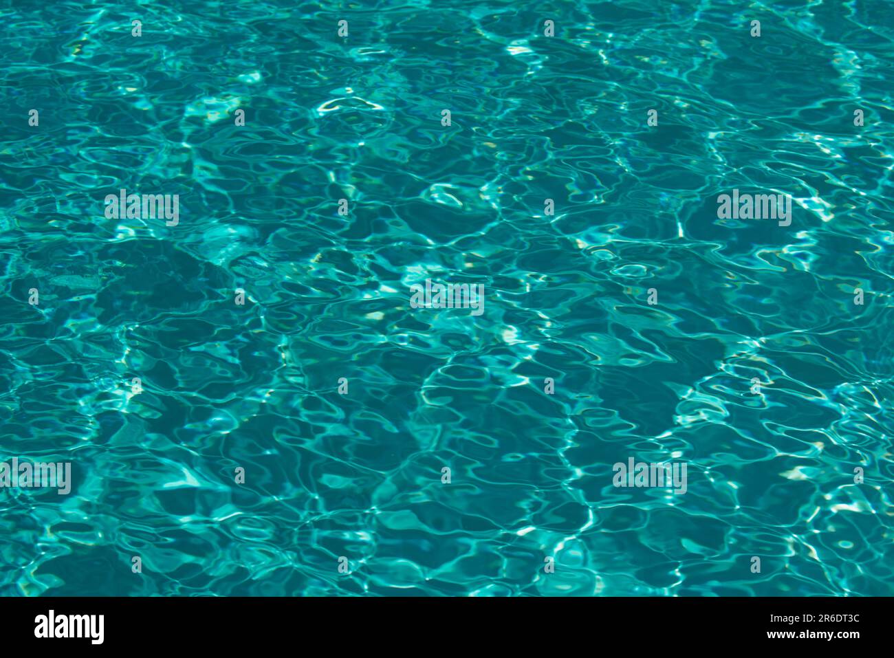 Abstract ripple wave and clear turquoise water surface in swimming pool ...