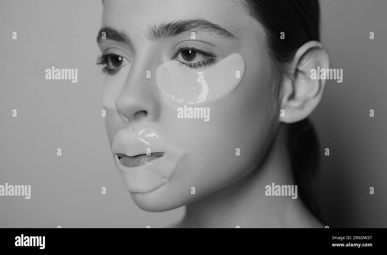 Healthy beautiful girl with natural makeup applies collagen catches for ...