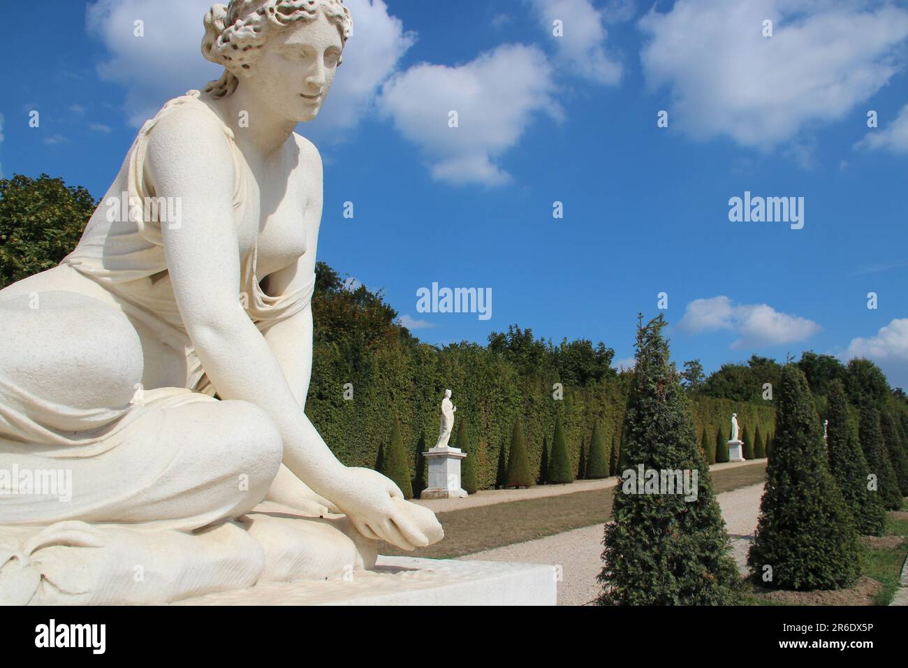 allegorical statue (nymph) in the gardens of the castle of versailles ...