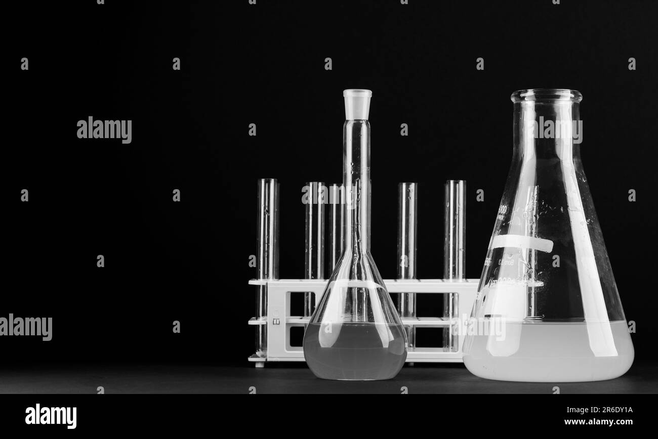 Close up of chemistry test tubes and dishes with liquid and copy space ...