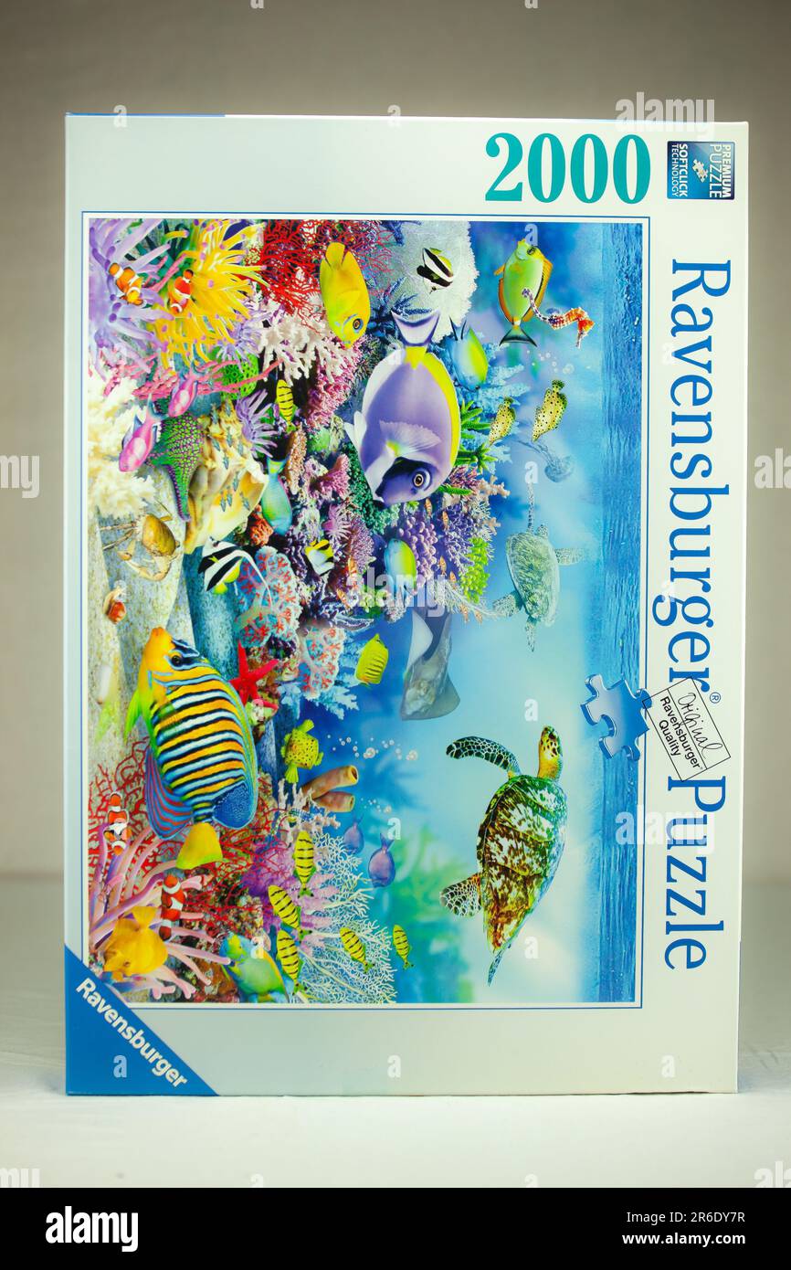 A white cardboard box of Ravensburger Puzzle on a table Stock Photo - Alamy