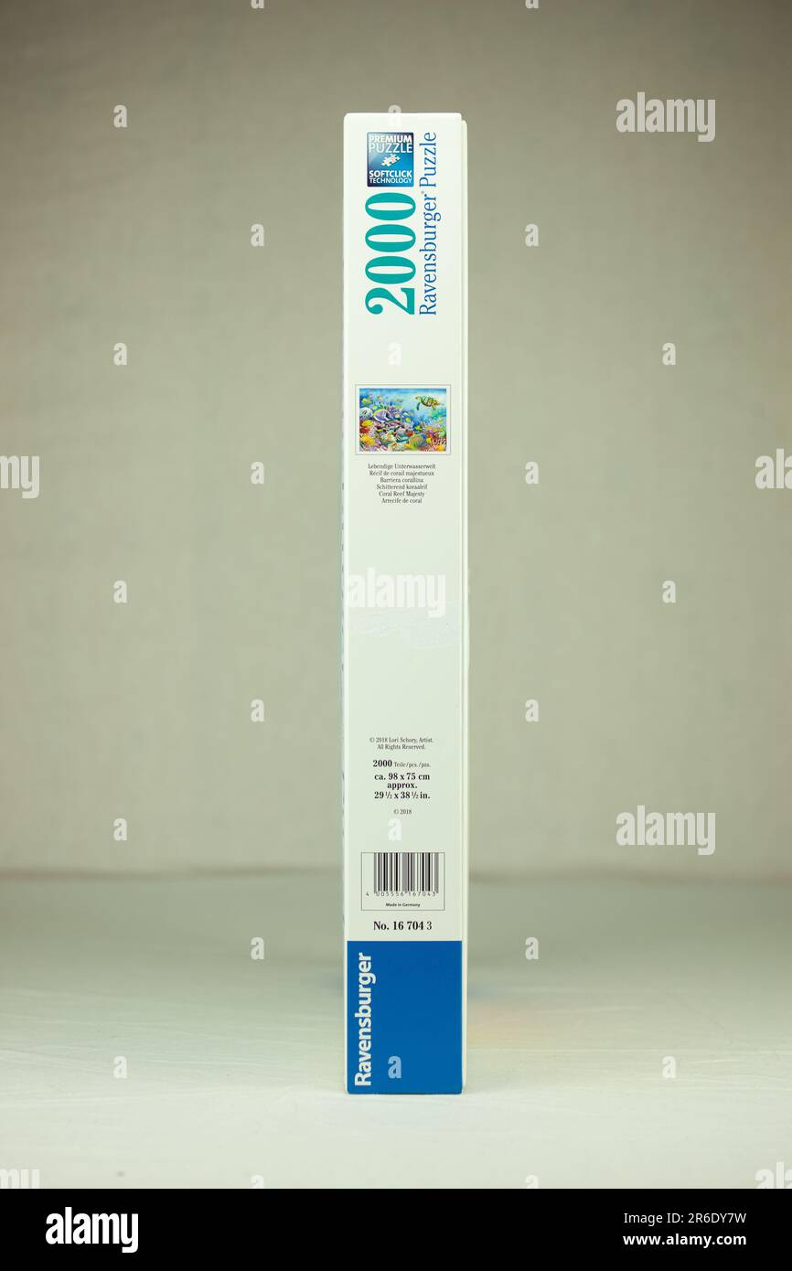 A white cardboard box of Ravensburger Puzzle on a table Stock Photo - Alamy