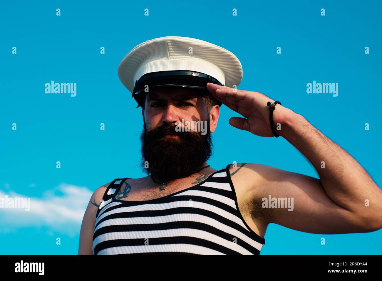 Funny captain sailor wearing hat. Seaman fun Stock Photo - Alamy