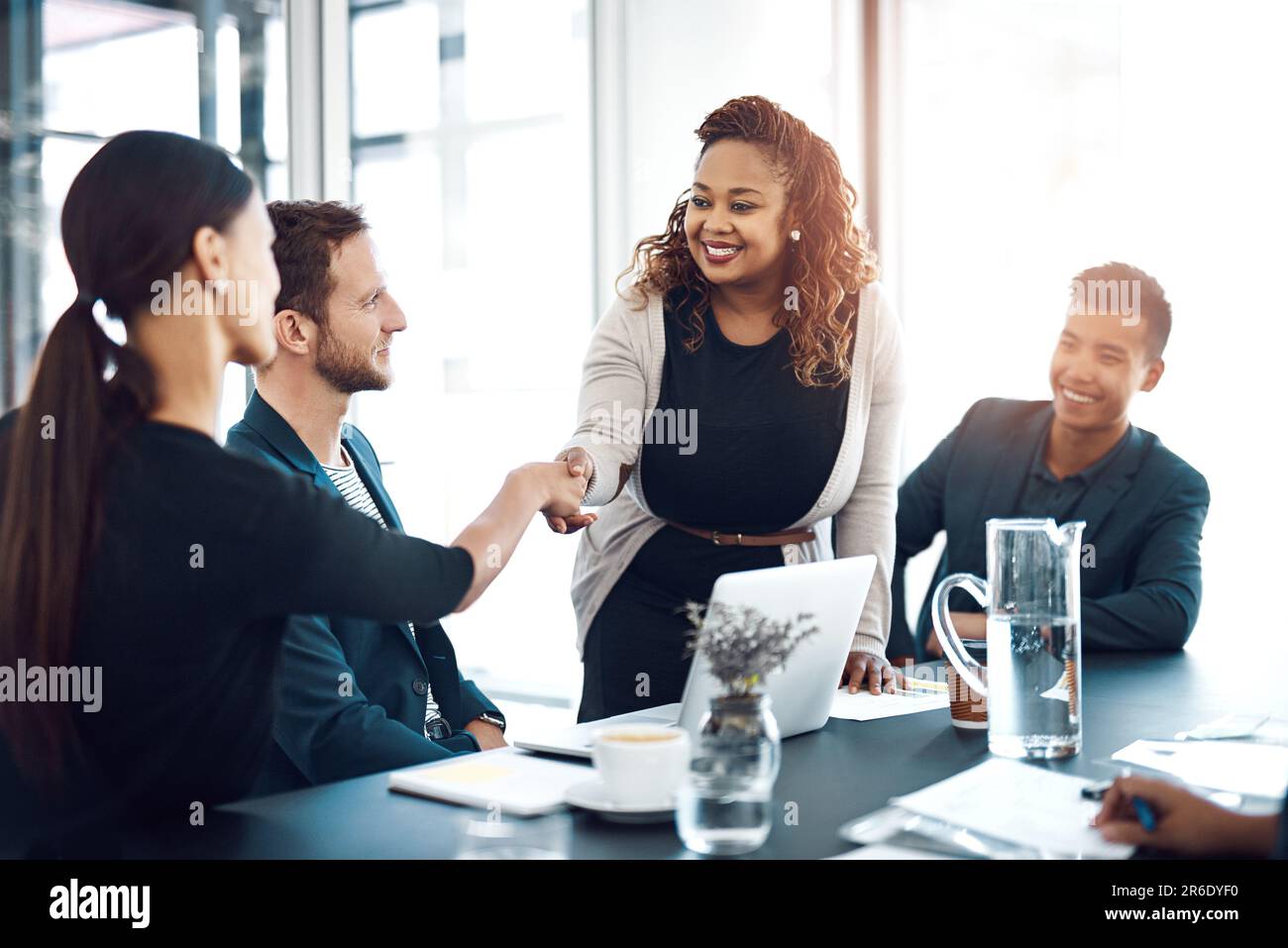 Onboarding, welcome and business people with a handshake in a meeting ...