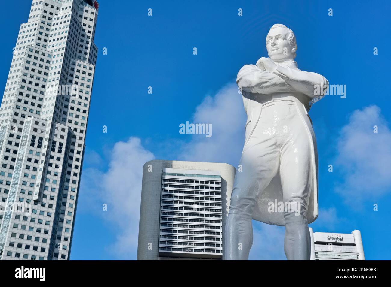 Statue of Sir Stamford Raffles at Raffles' Landing Site by the Singapore River, high rise ...