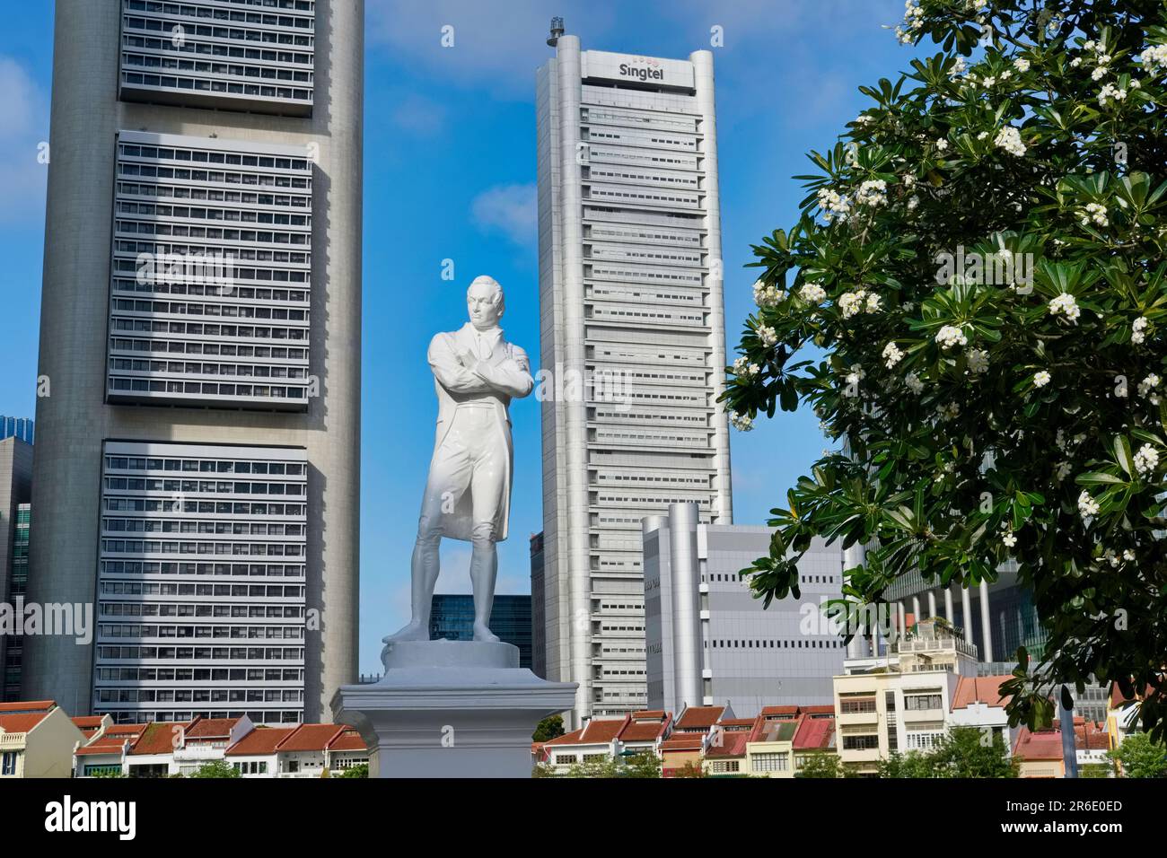 Statue of Sir Stamford Raffles at Raffles' Landing Site by the Singapore River, high rise ...