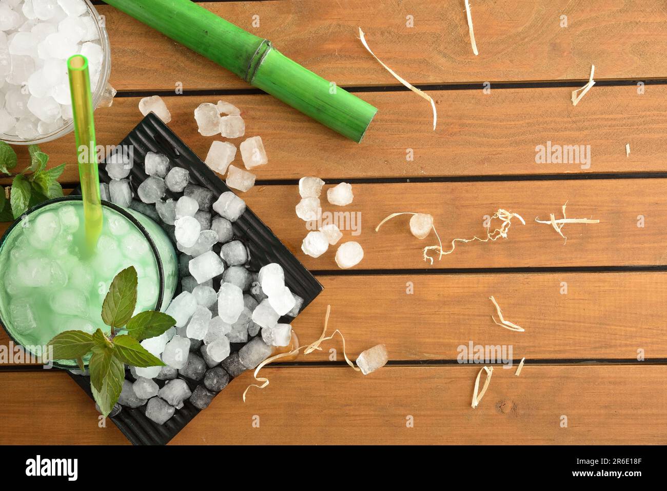 Background with natural iced mint on wooden table with crushed ice ...