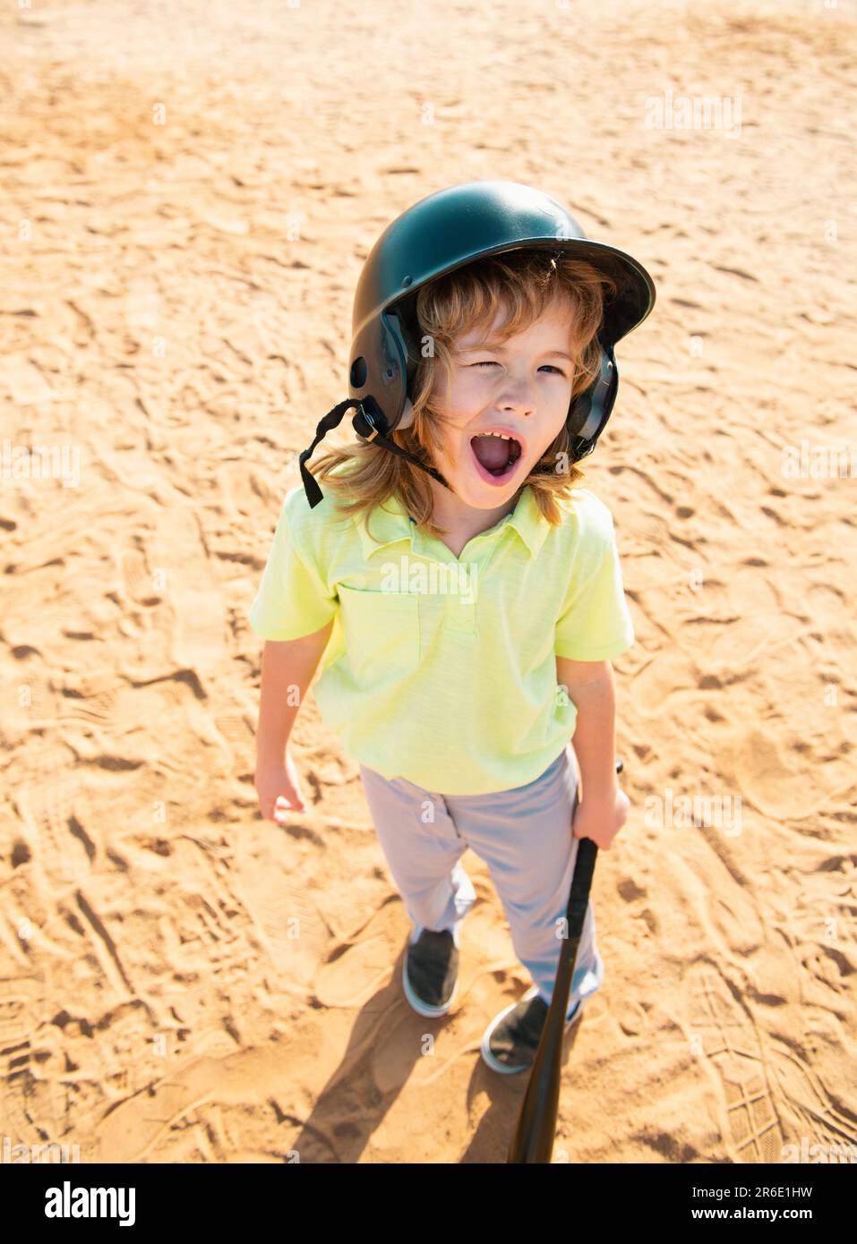 Baseball players funny kid winking ah hold bat Stock Photo - Alamy