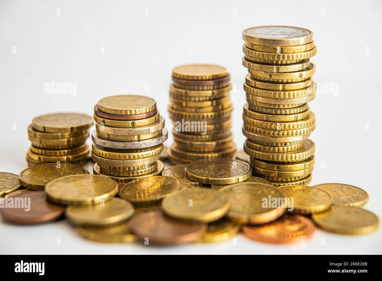 Stacks of euro coins placed on white surface. Money and value of money ...