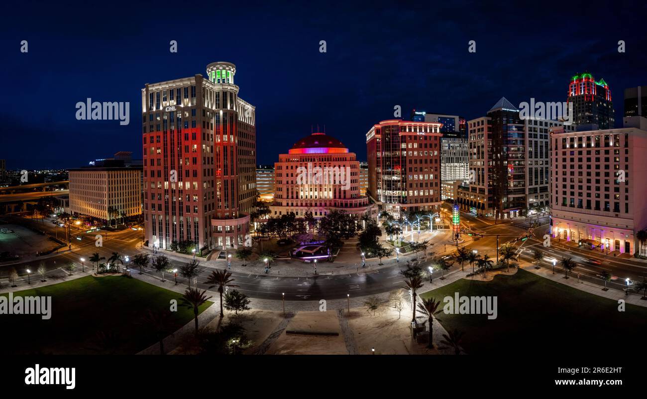 An aerial view of the skyline of Orlando at night, illuminated by ...