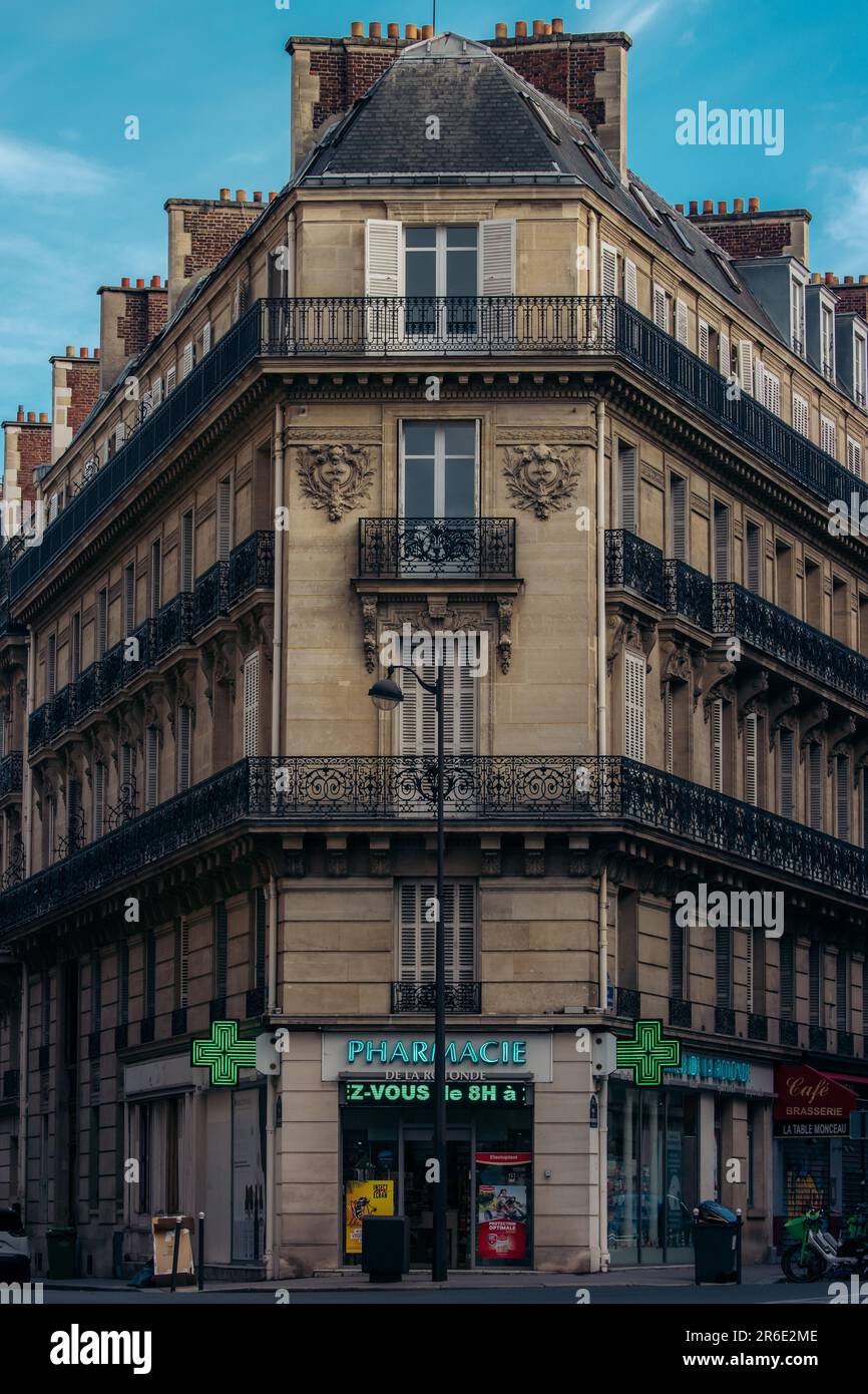 A vertical shot of a historic building in Paris, France, featuring a ...
