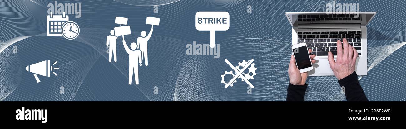 Top view of hands using laptop and mobile phone with symbol of strike ...