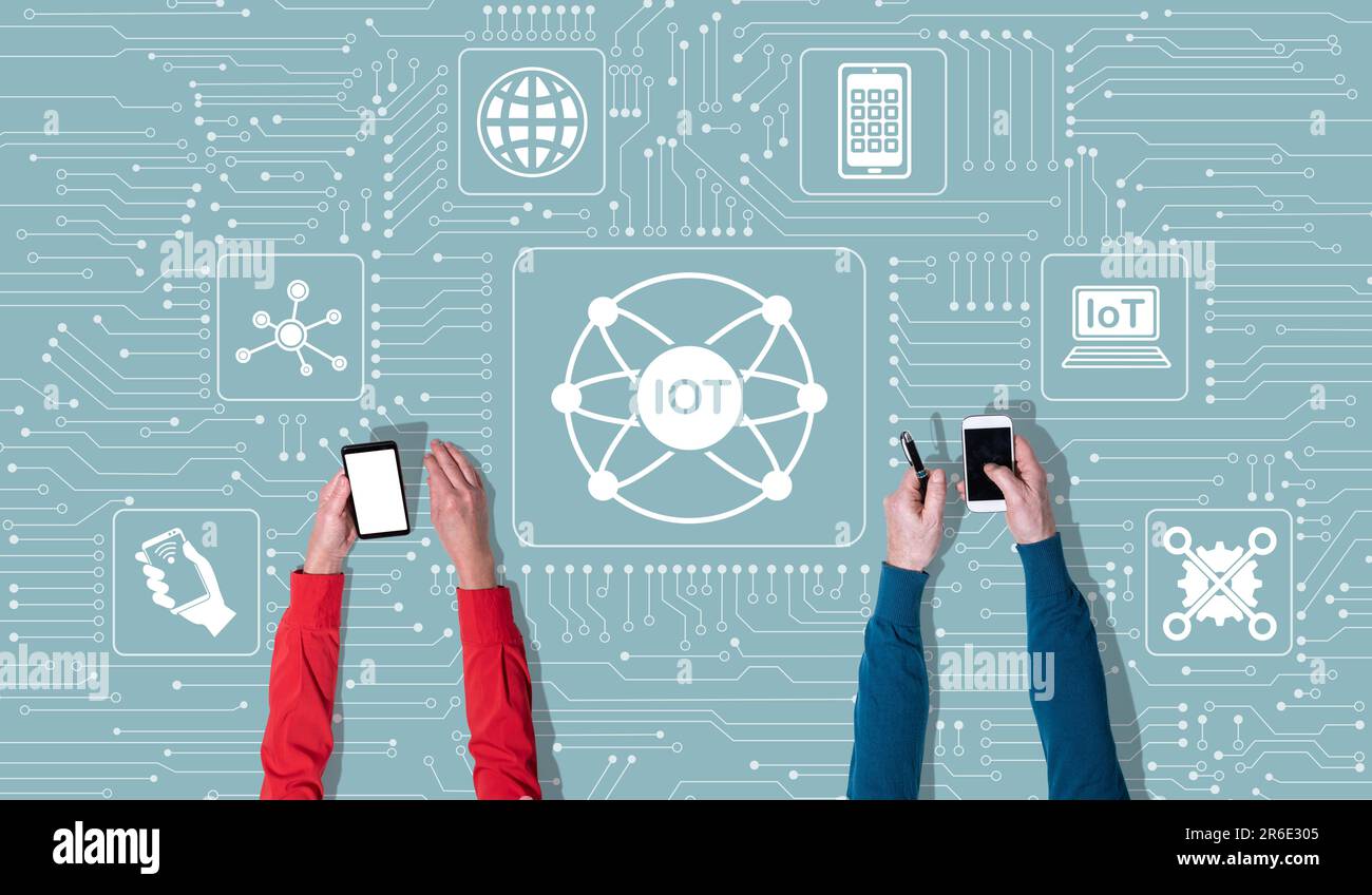 Top view of hands using mobile phone with symbol of iot concept Stock ...