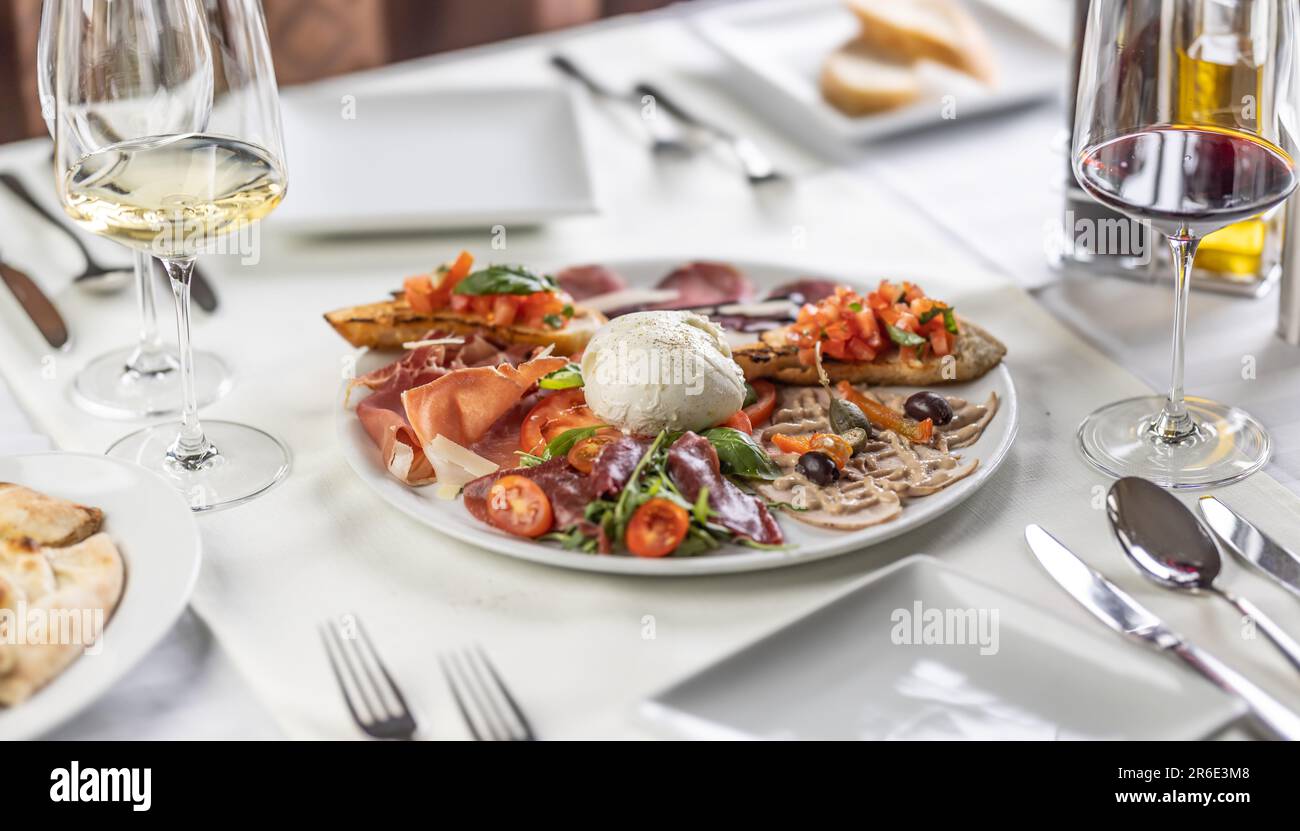 Italian antipasti appetizer for more people, with various types of food ...