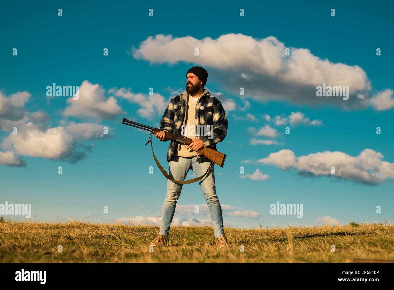 Hunting without borders. Hunter with shotgun gun on hunt. Closed and ...