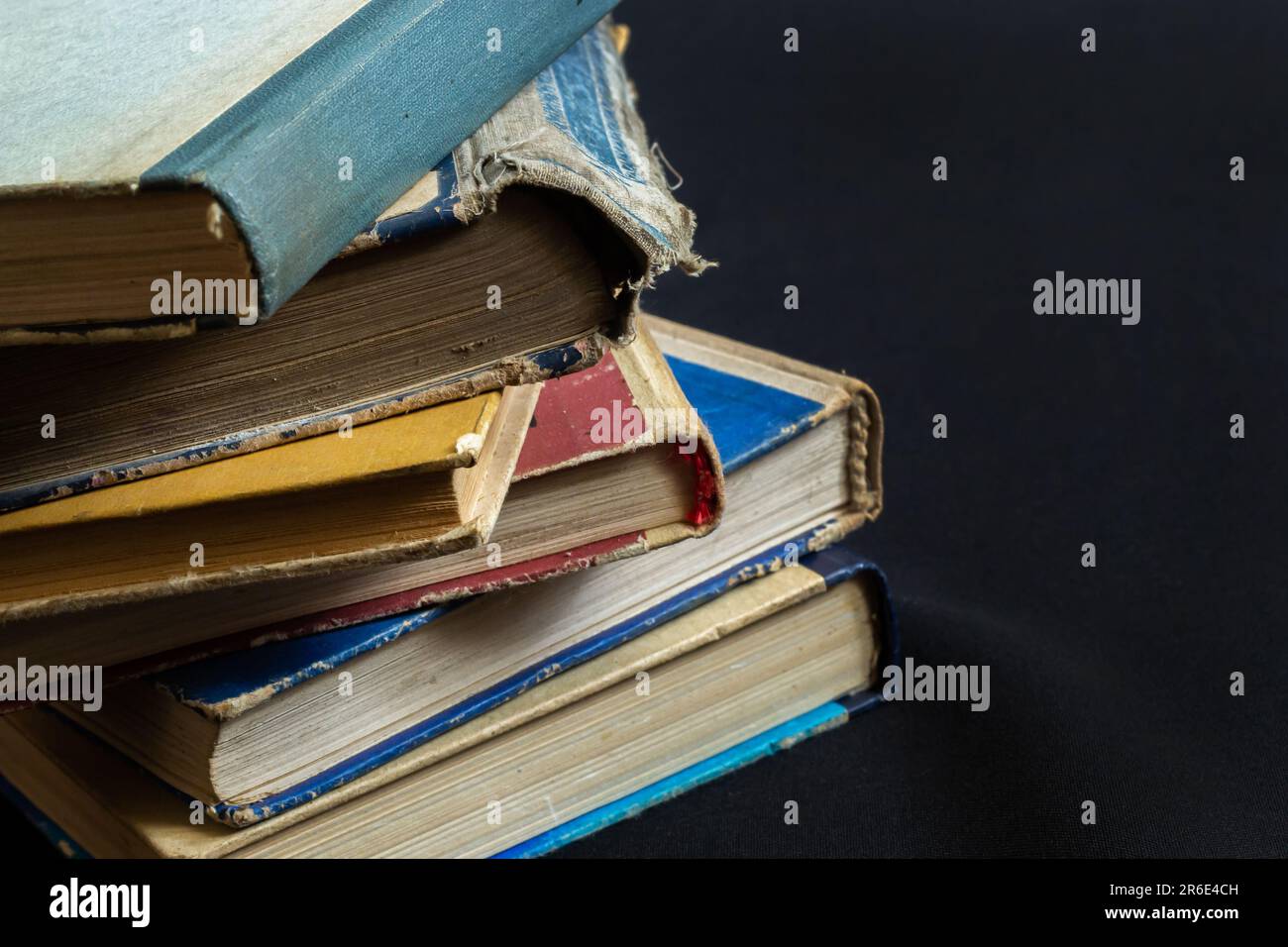 Book background. Stack of books in the library. Old yellow pages of ...