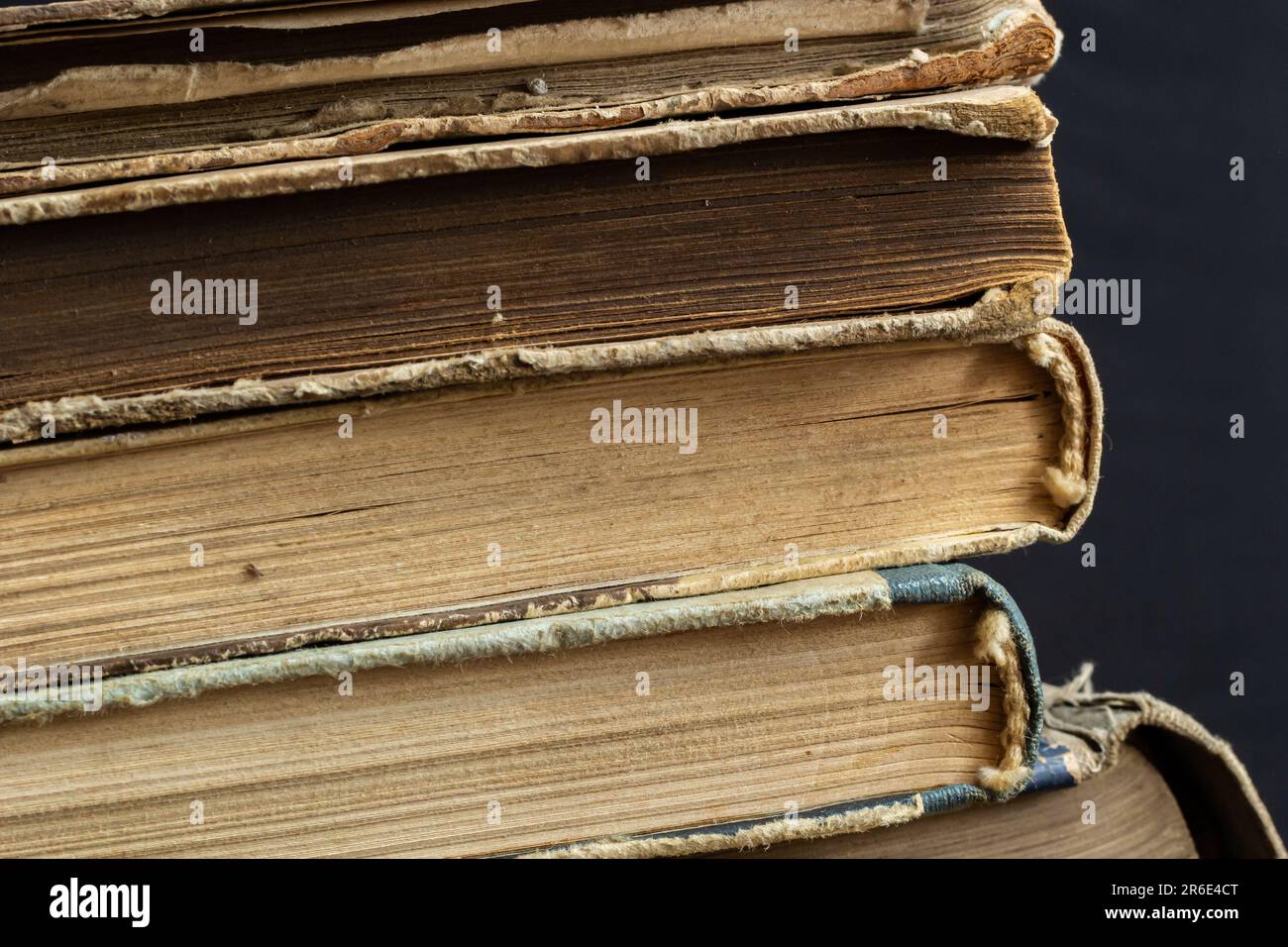 Book background. Stack of books in the library. Old yellow pages of ...