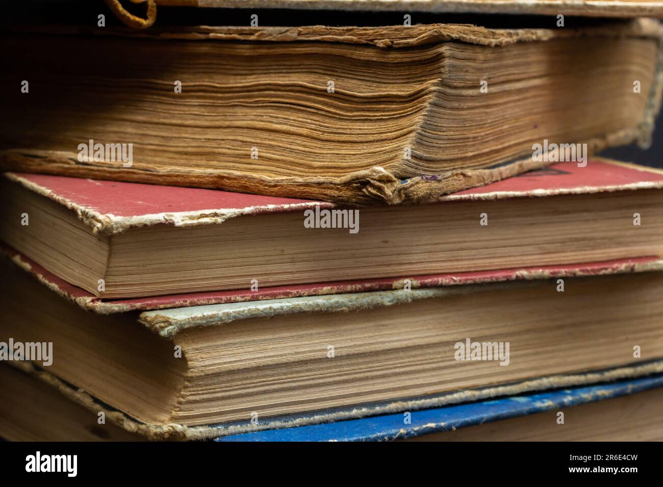 Book background. Stack of books in the library. Old yellow pages of ...