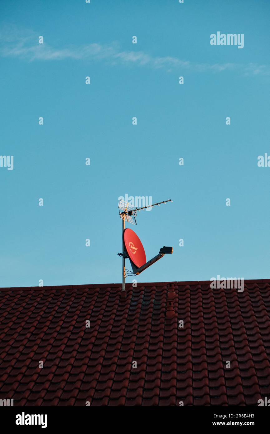 An aerial view of a satellite set up on the roof of a modern building ...