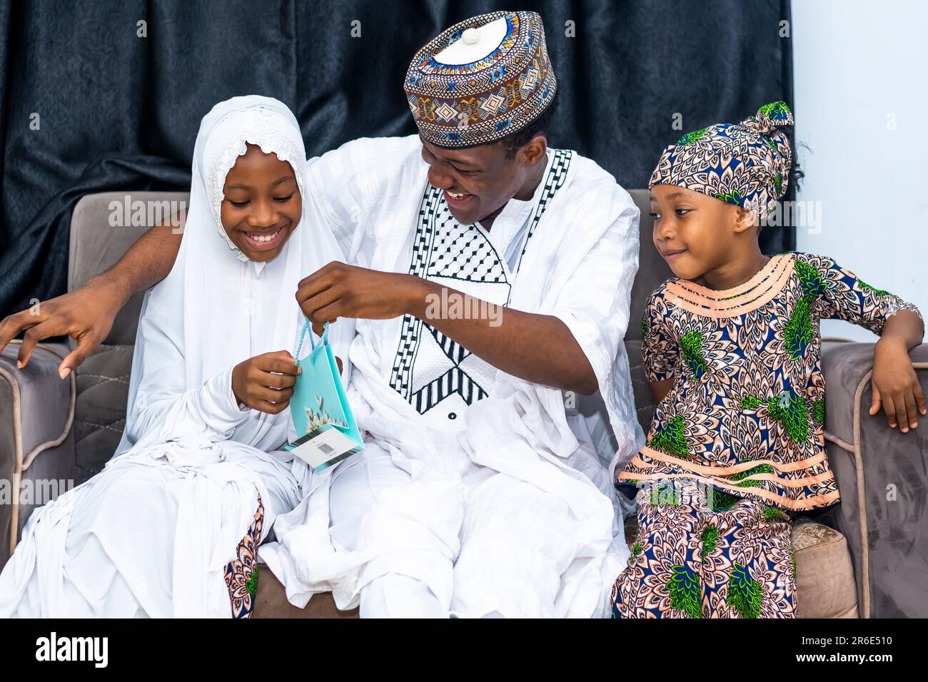 happy african father giving gift to his children. Joyful family ...