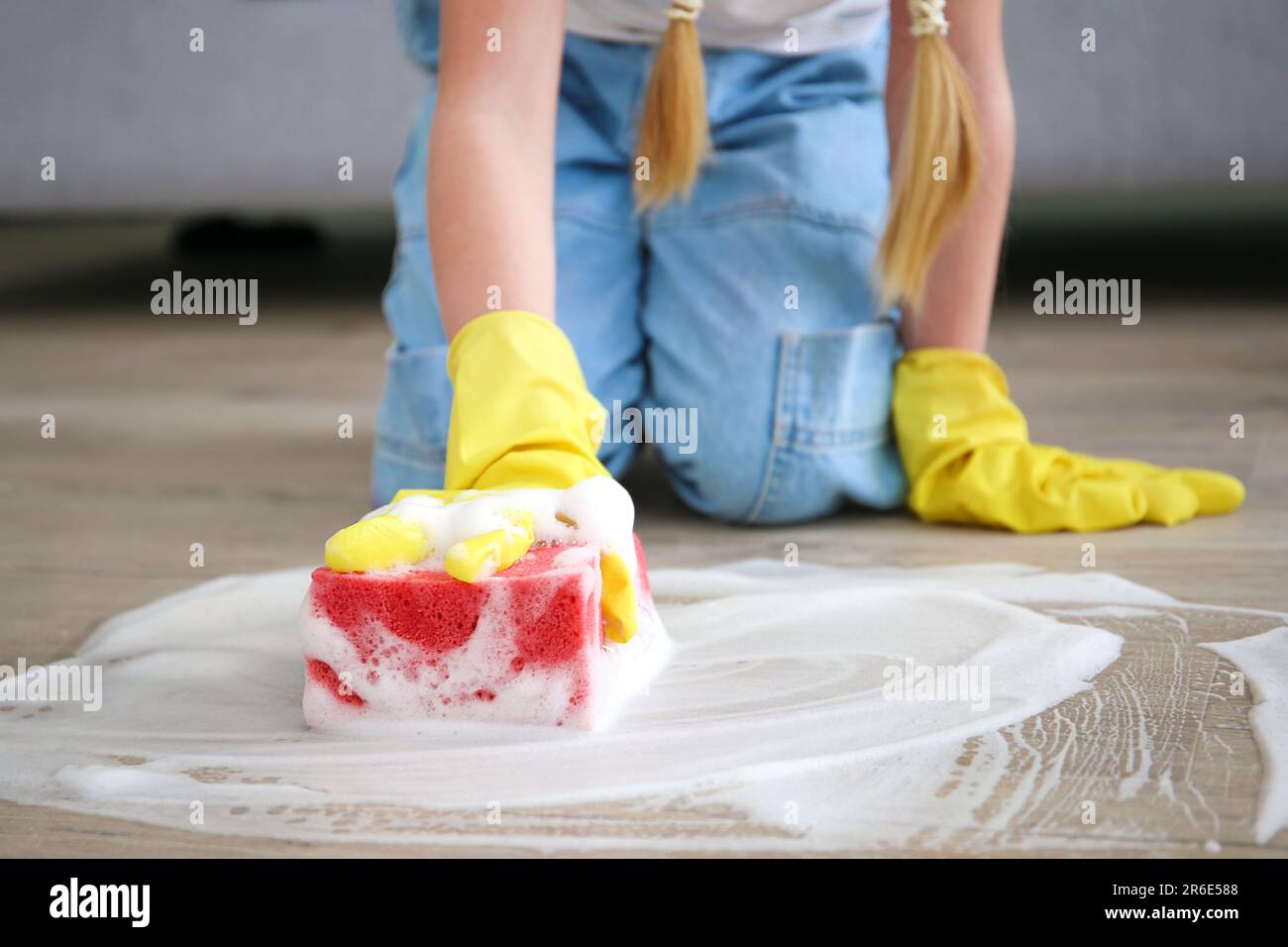 The child washes the floors of the house. The concept of child labor ...