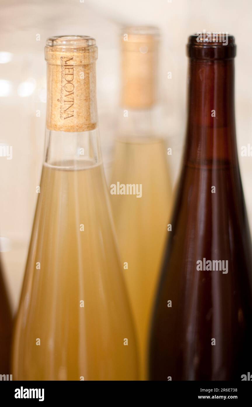 Bottles of Mead or Honey Wine sit corked in clear glass bottles showing ...