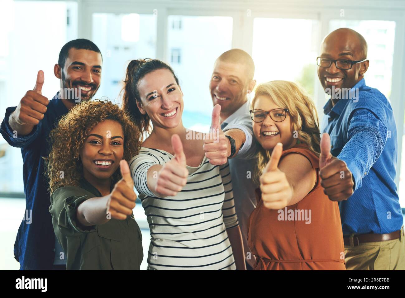 Collaboration, thumbs up and portrait of staff with diversity, like and thank you sign of ...