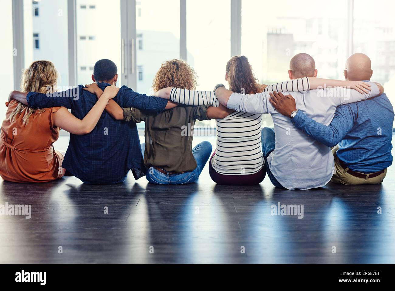 Teamwork, solidarity and hug with back of people for motivation ...