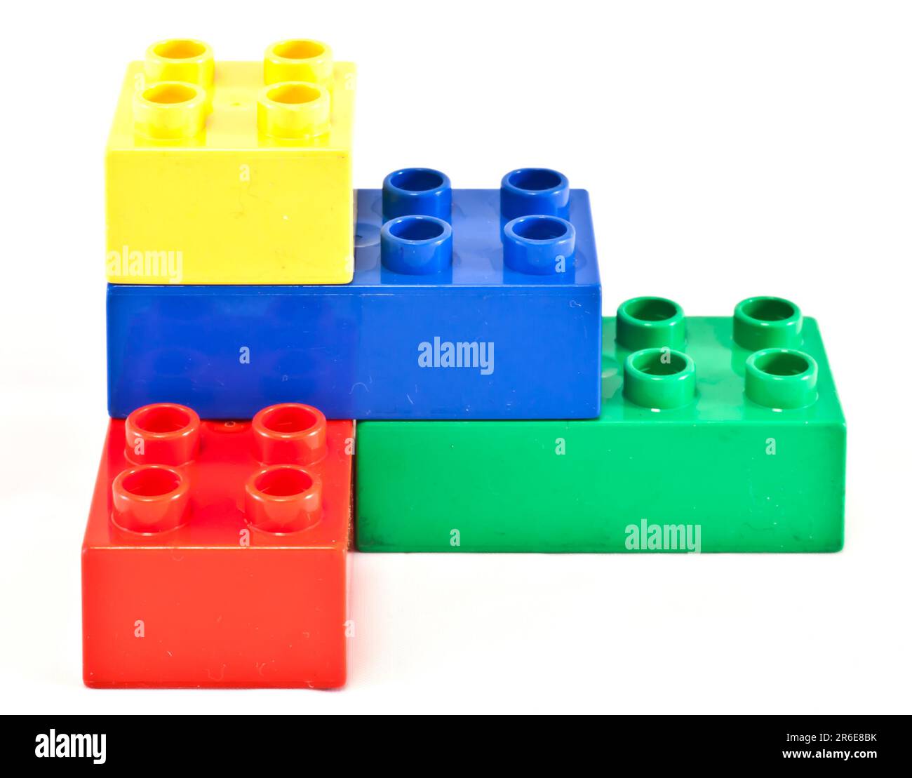 Plastic building blocks on white background. Bright colors Stock Photo ...