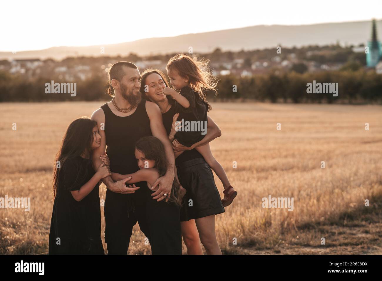 happy family Three daughters dad mom walk in the countryside in nature ...