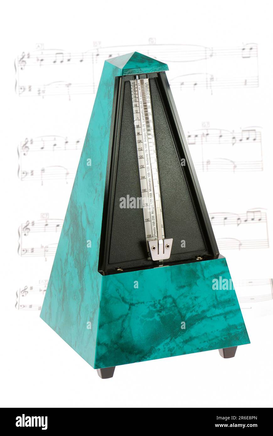 Musical Metronome isolated on white Stock Photo - Alamy