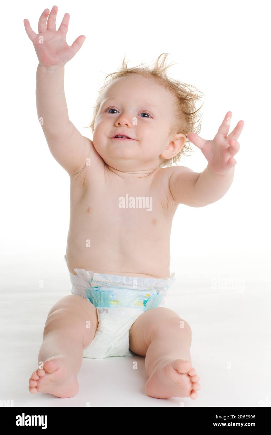 Cute baby in nappy playing on white background Stock Photo - Alamy