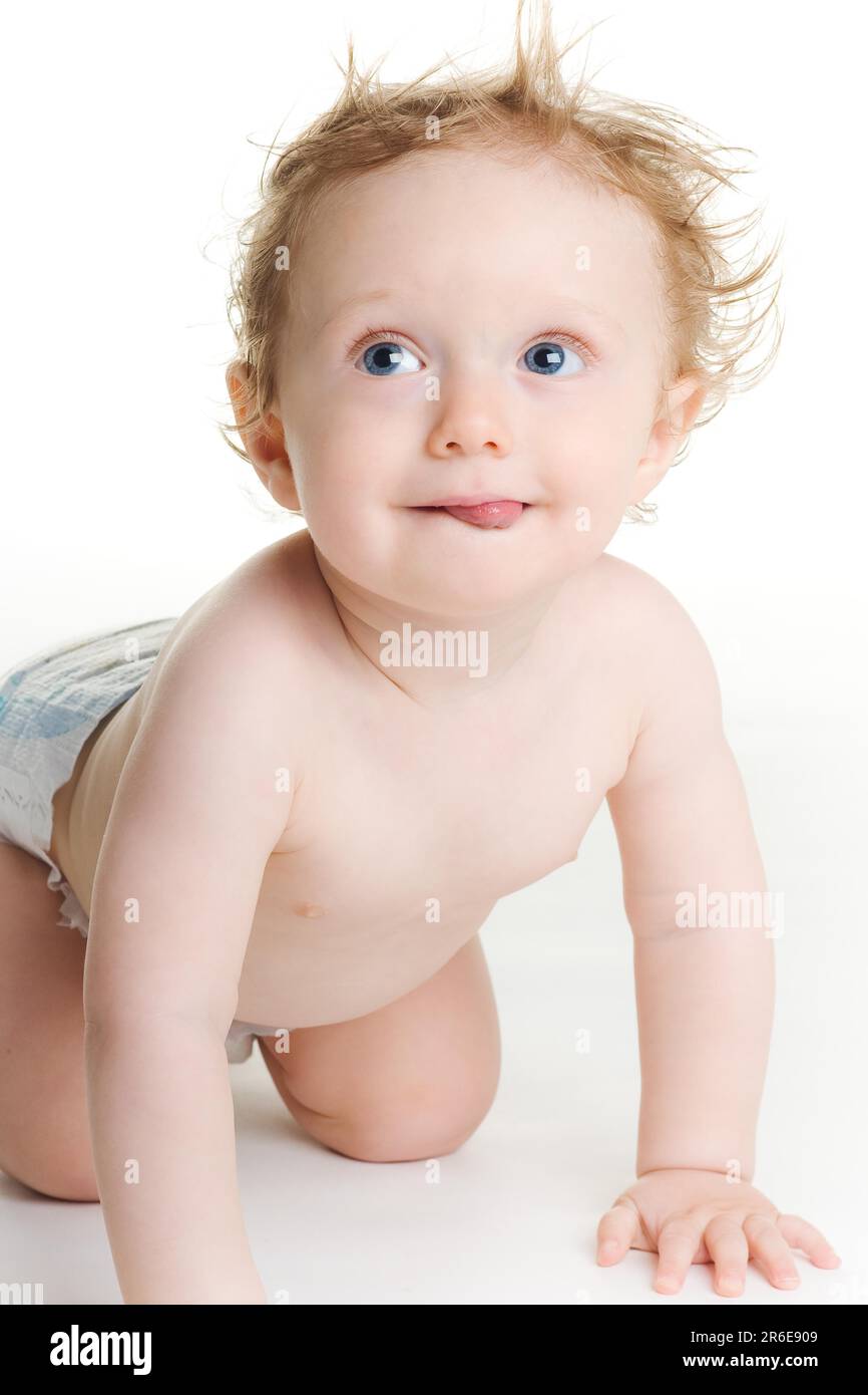 Cute baby in nappy crawling on white background Stock Photo - Alamy