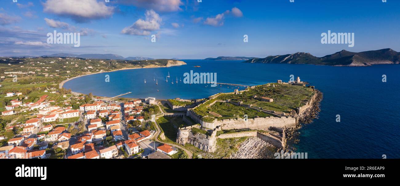 Methoni city in Greece with boats in the bay and the ancient castle ...