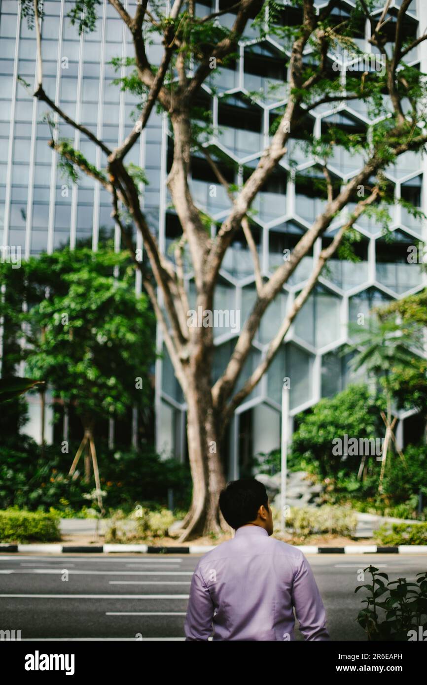 Man outside architecture building in city scape Stock Photo - Alamy
