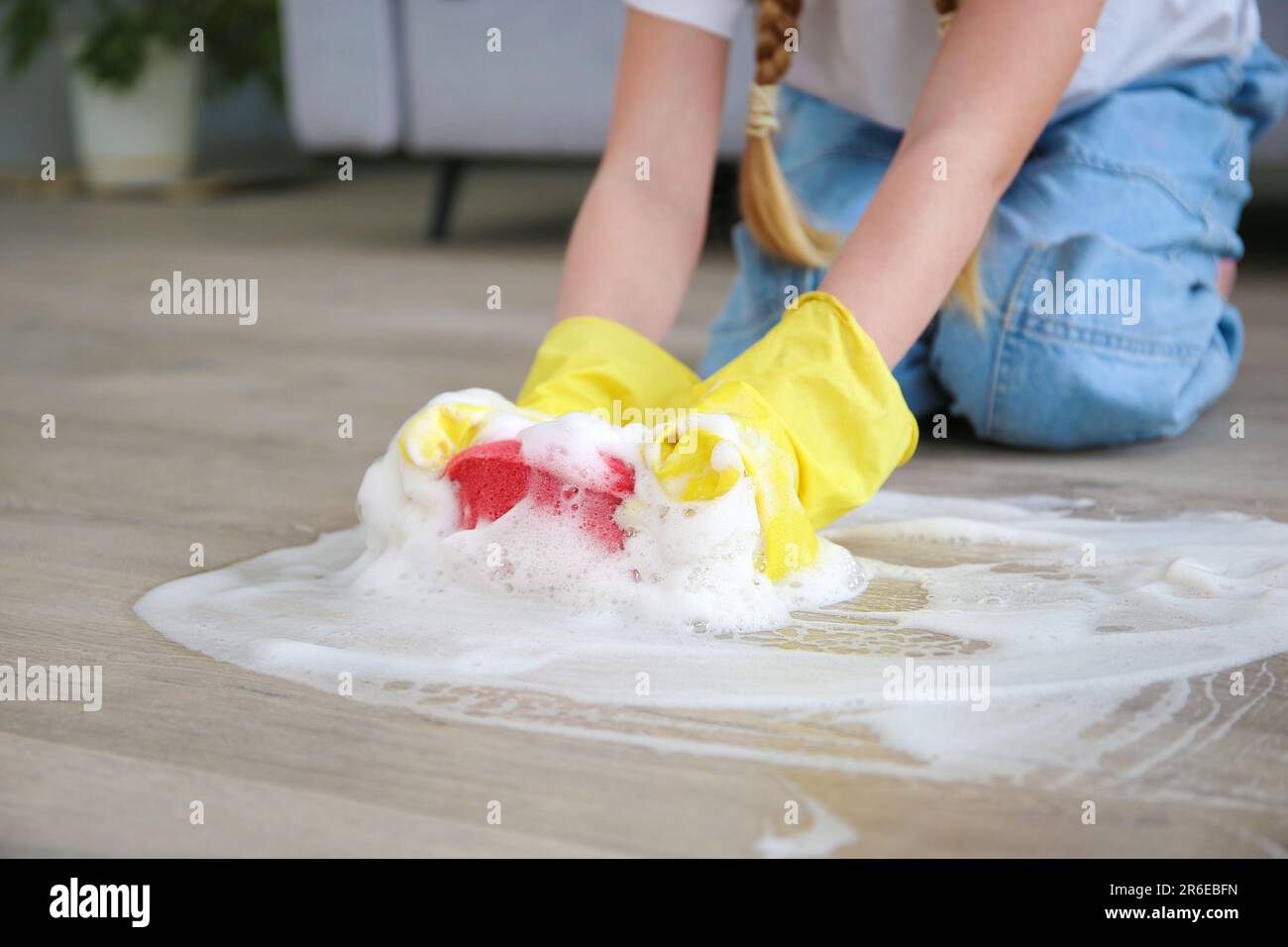 The child washes the floors of the house. The concept of child labor ...