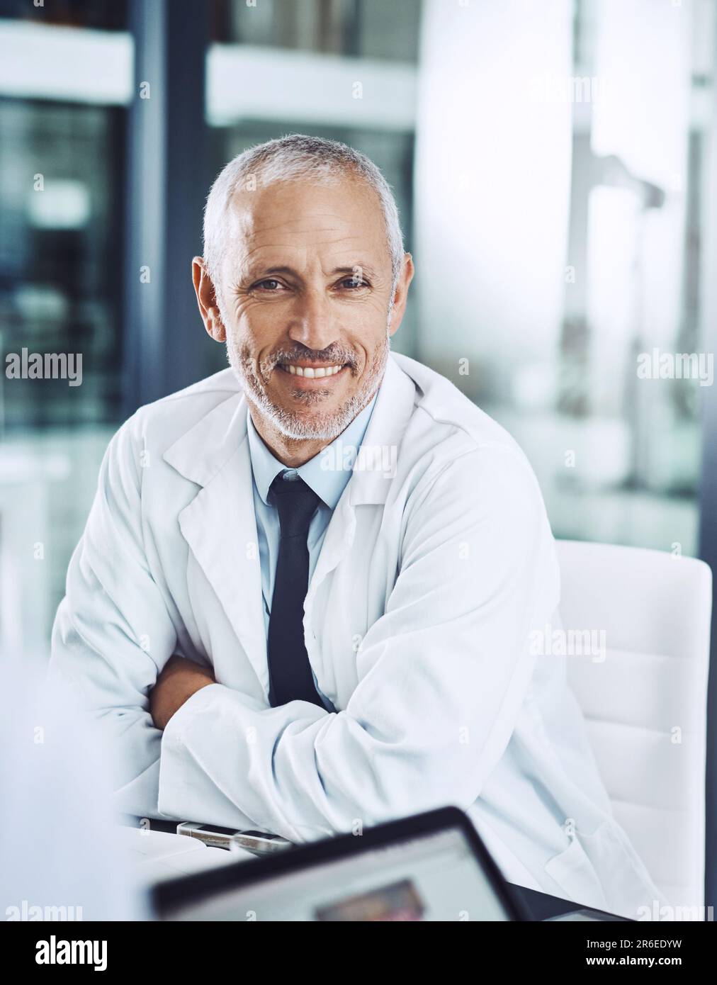 Healthcare, portrait and senior doctor at desk with smile, pride and ...