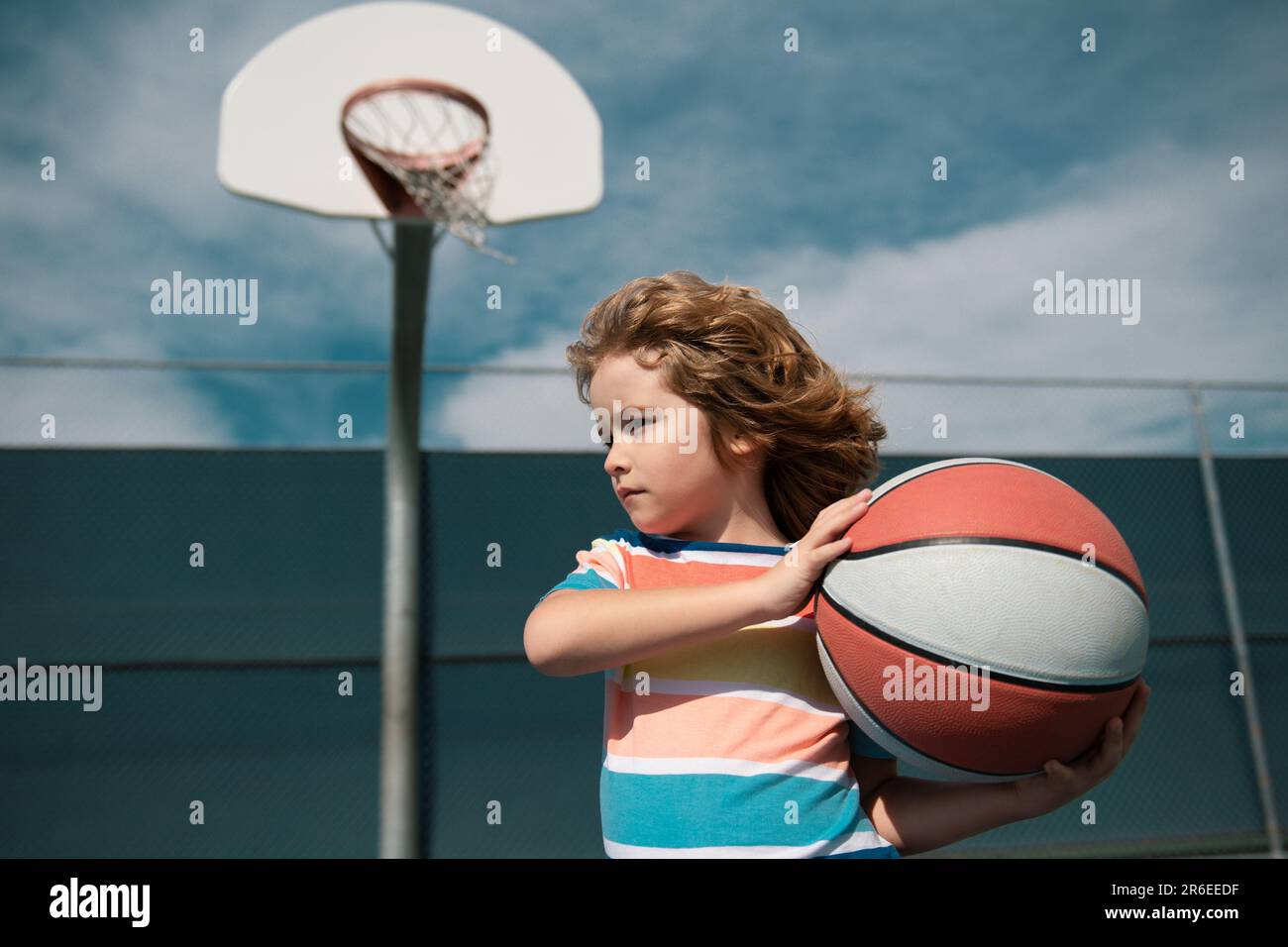 Cute child playing basketball. Basketball kids training game. Active ...