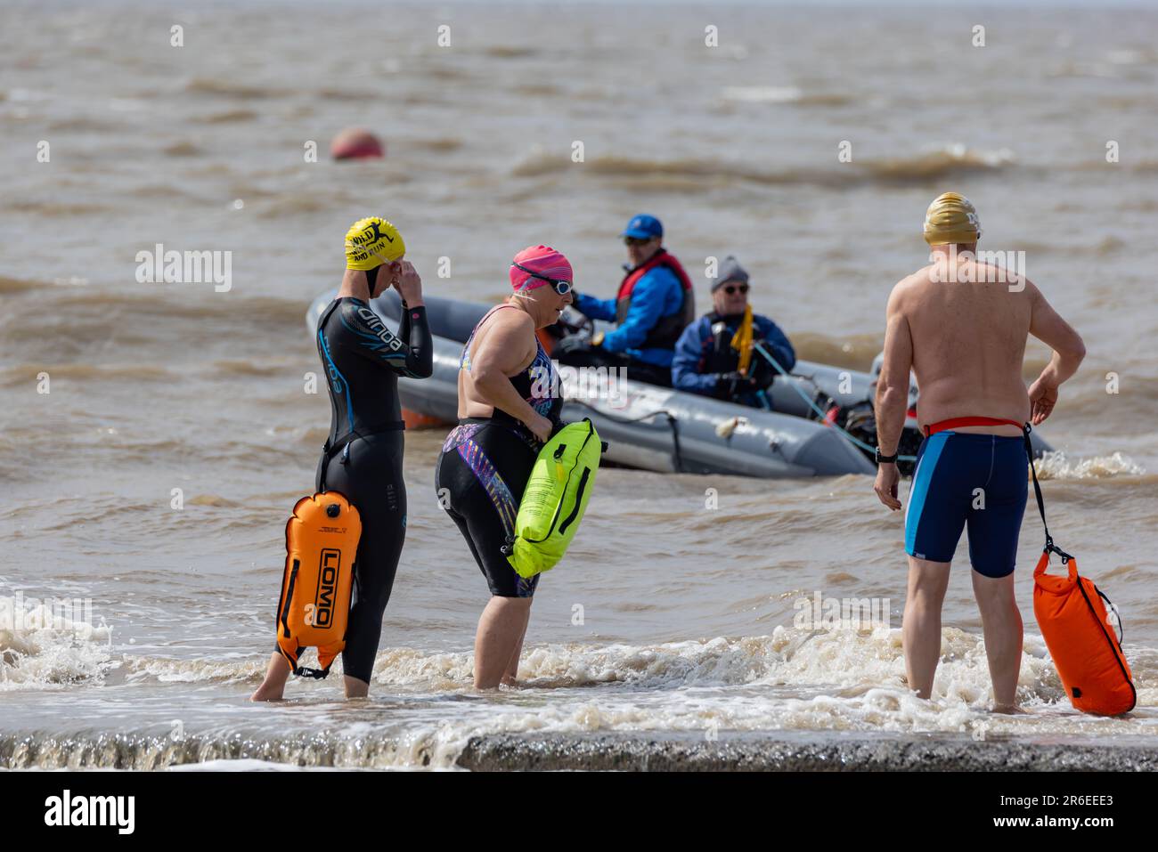 Cold water swimmers thinking about getting into the water Stock Photo ...